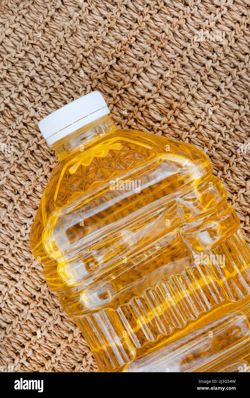 Top part of a 2litre bottle of sunflower cooking oil on white surface ...