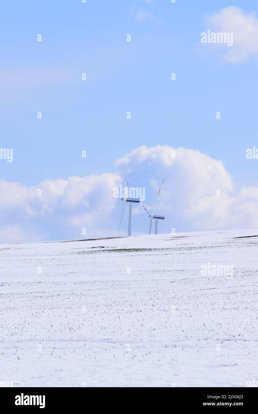 Wind turbines and Clouds in a wintry Landscape Stock Photo - Alamy
