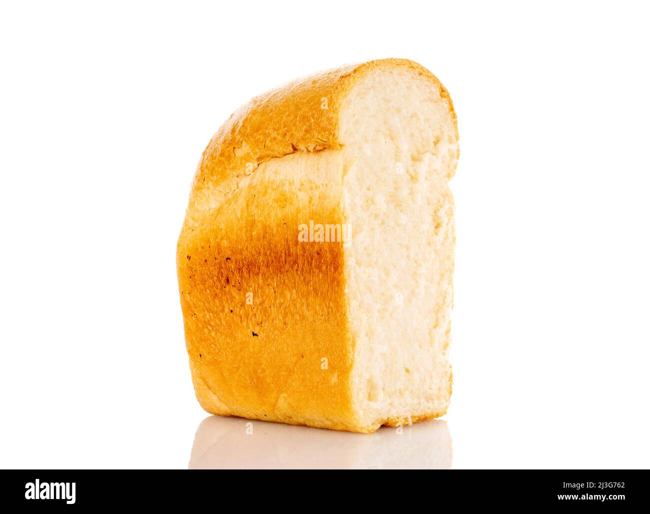 One half of a loaf of fresh fragrant white wheat bread, macro, isolated ...