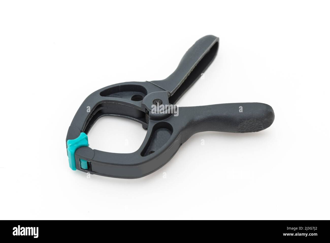 Black plastic clamp on the white background Stock Photo - Alamy