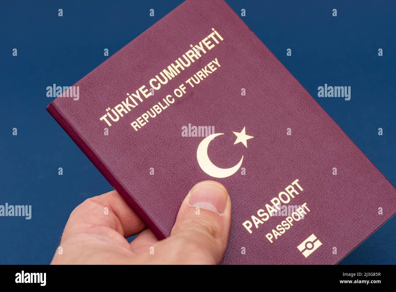 Turkish citizen public passport on the blue background Stock Photo - Alamy