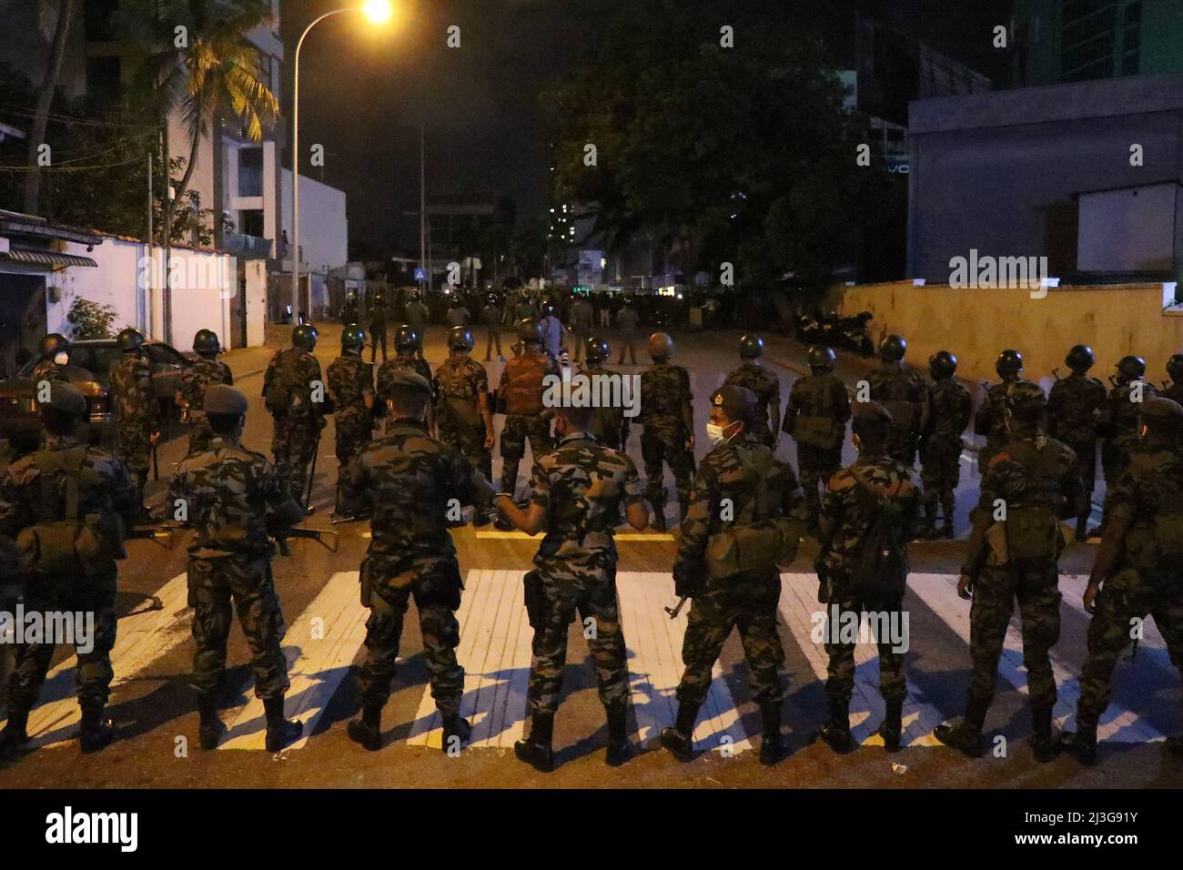 Colombo, Sri Lanka. 7th Apr, 2022. Police stand guard as demonstrators ...