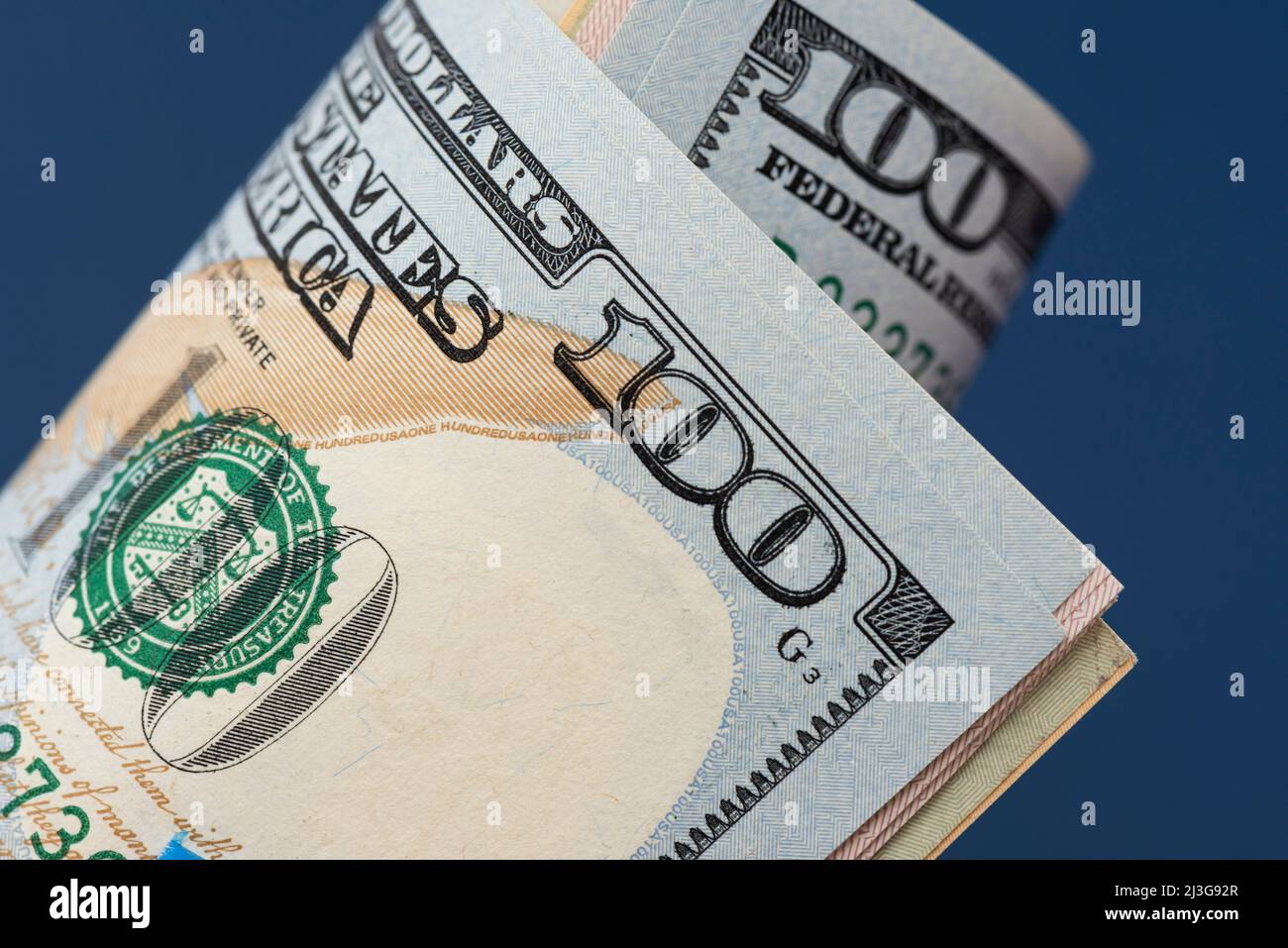 American dollars. A stack of hundred dollar bills. Close up of new ...