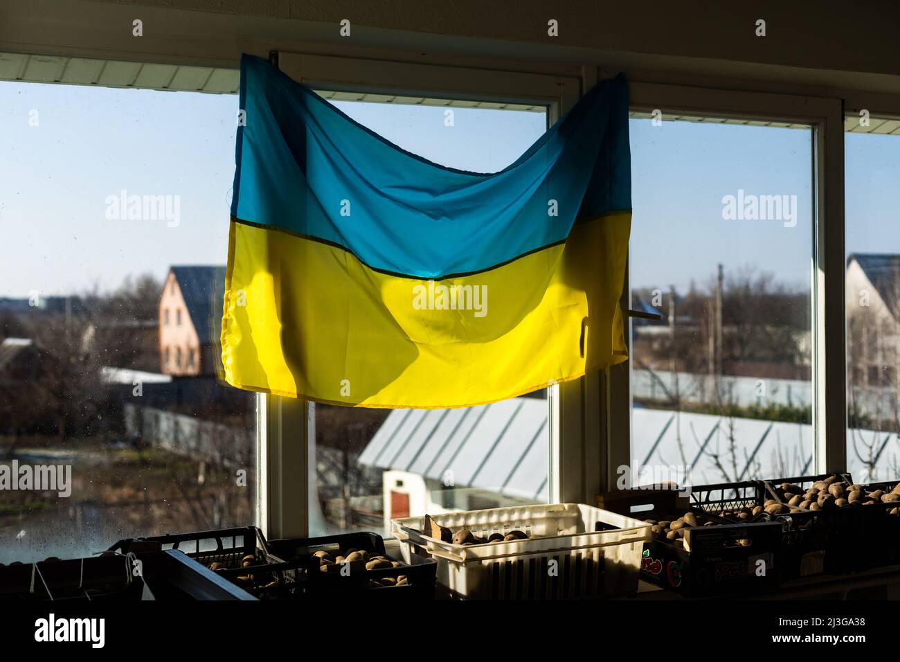 Support Ukraine. Ukrainian flag on the window. Place for text Stock ...