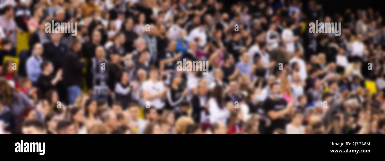 blurred background of supporters at sports event crowd of people in a ...