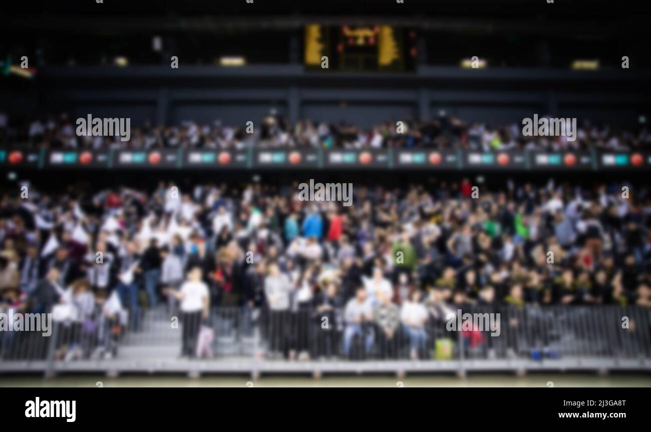 blurred background of supporters at sports event crowd of people in a ...