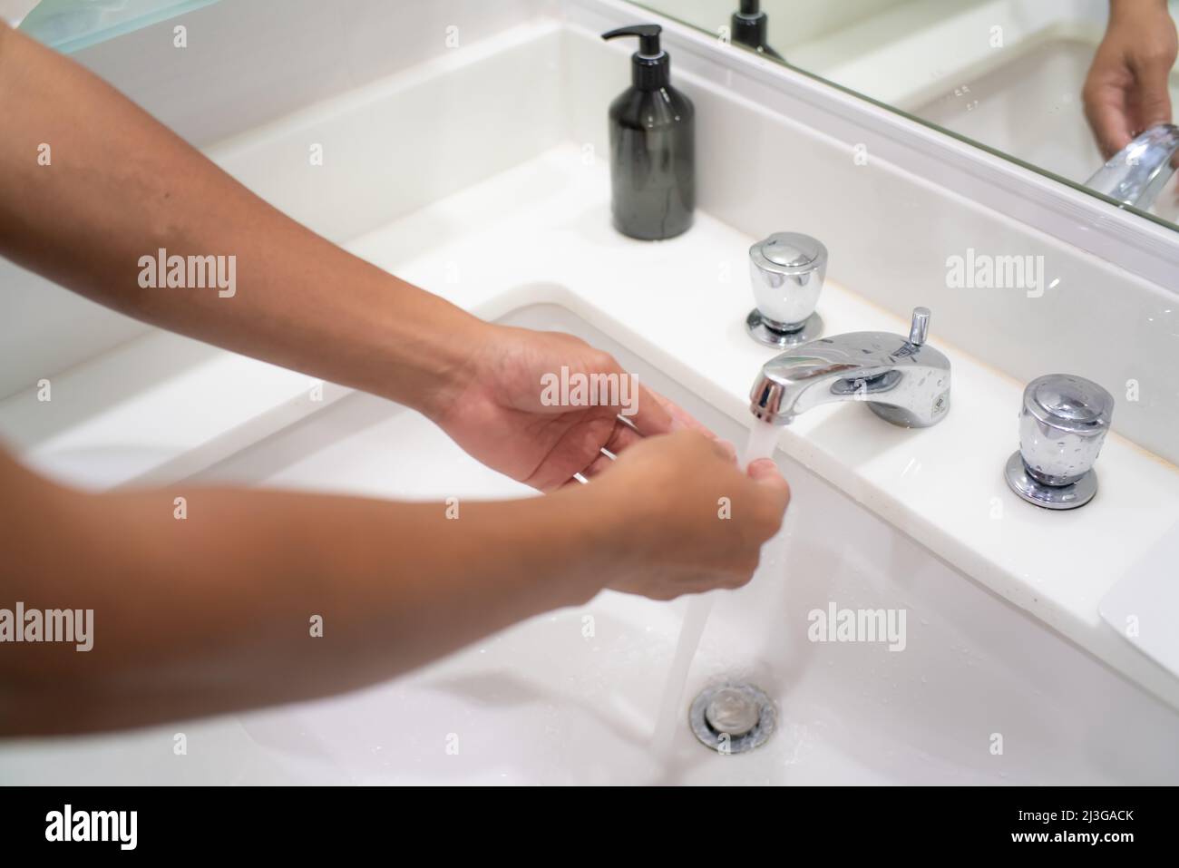 Women hand wash in hotel basin hygiene healthcare Stock Photo - Alamy