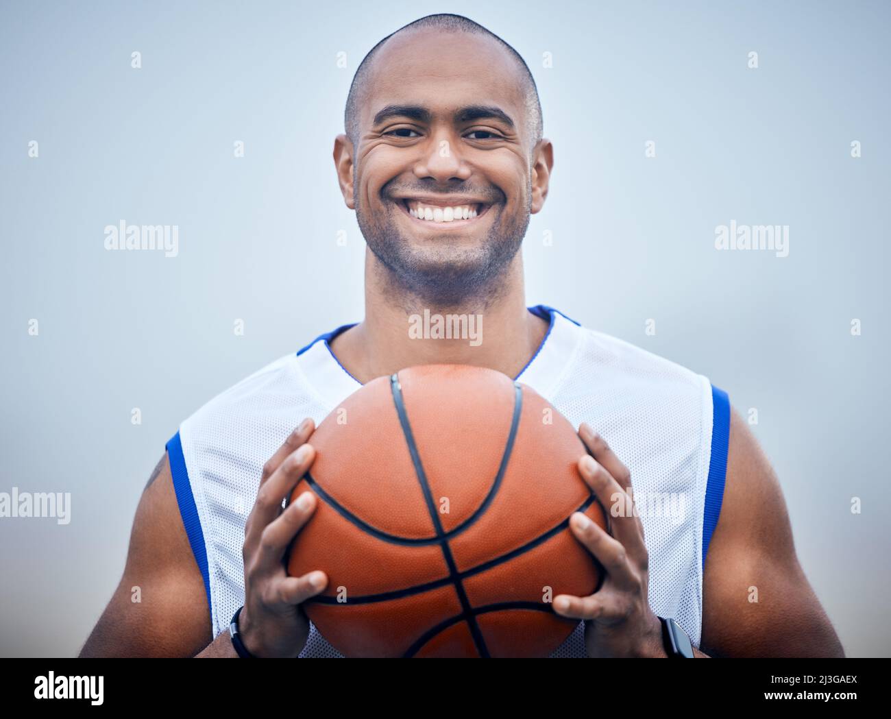 Keep your eye on the prize. Shot of a young male basketball player ...