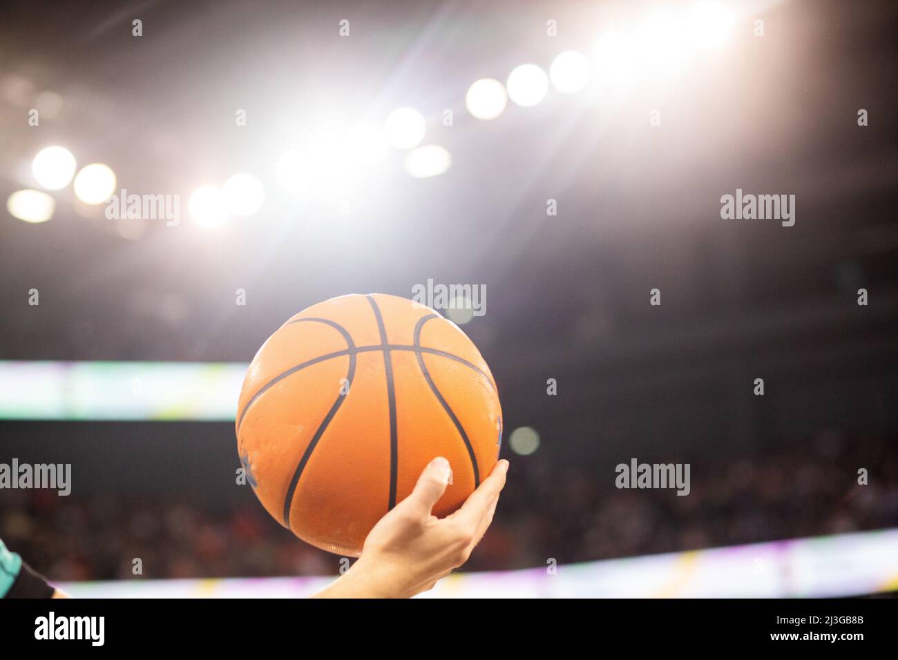 referee holding basketball during game Stock Photo - Alamy