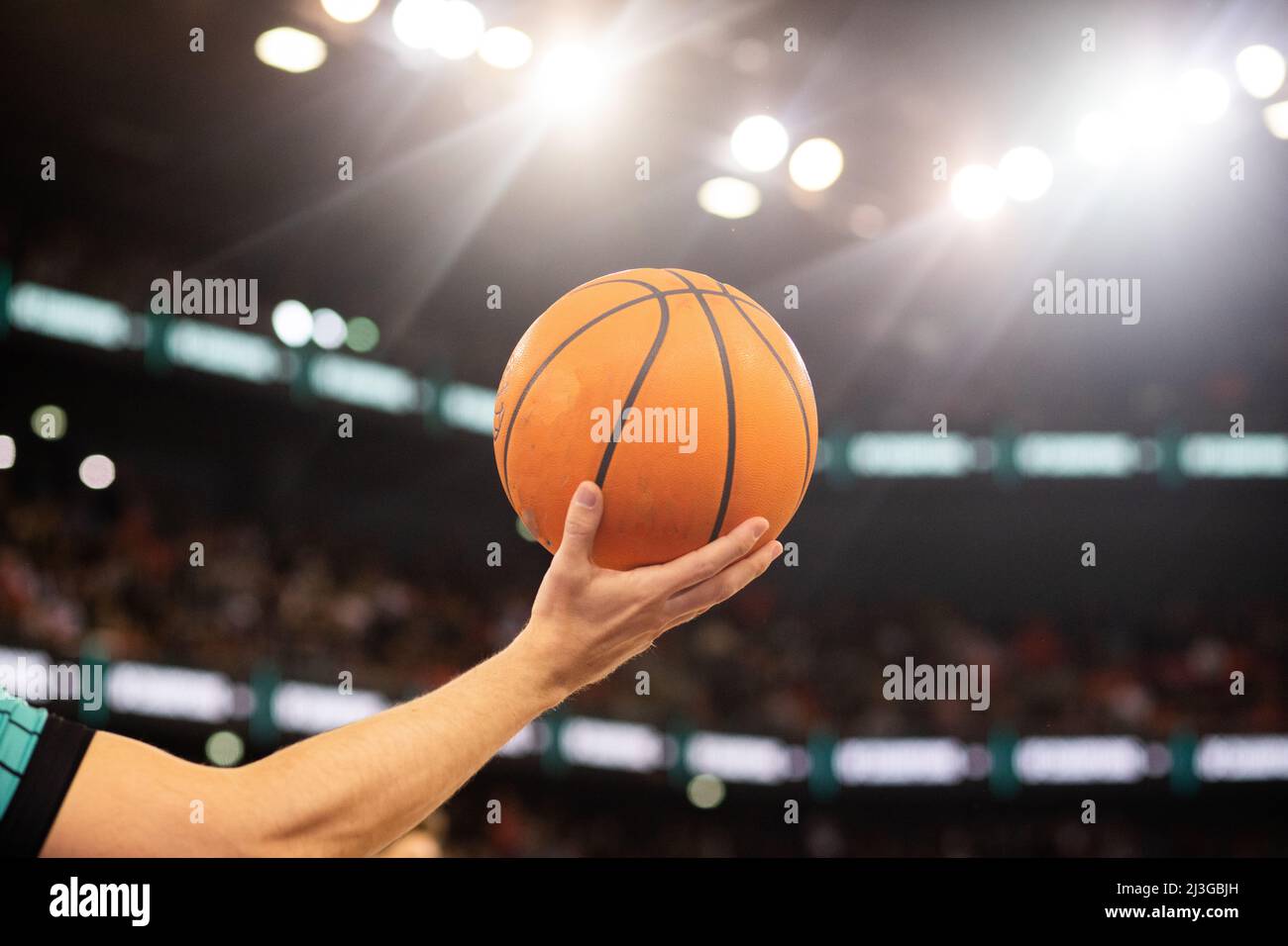 referee holding basketball during game Stock Photo - Alamy