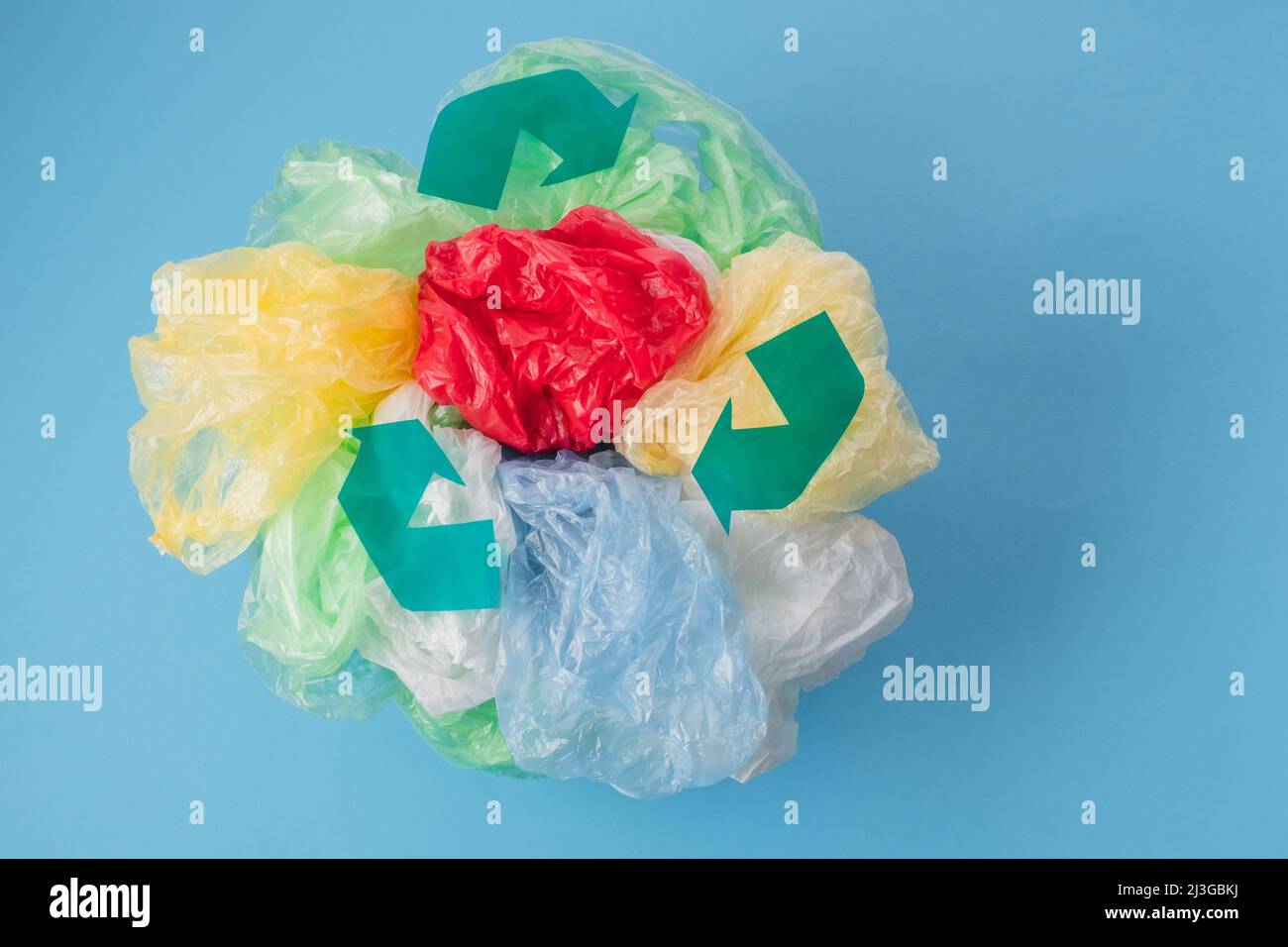 Recycling sign on plastic bags and plastic wraps of different colors on ...