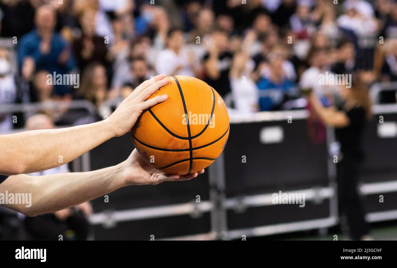 referee holding basketball during game Stock Photo - Alamy