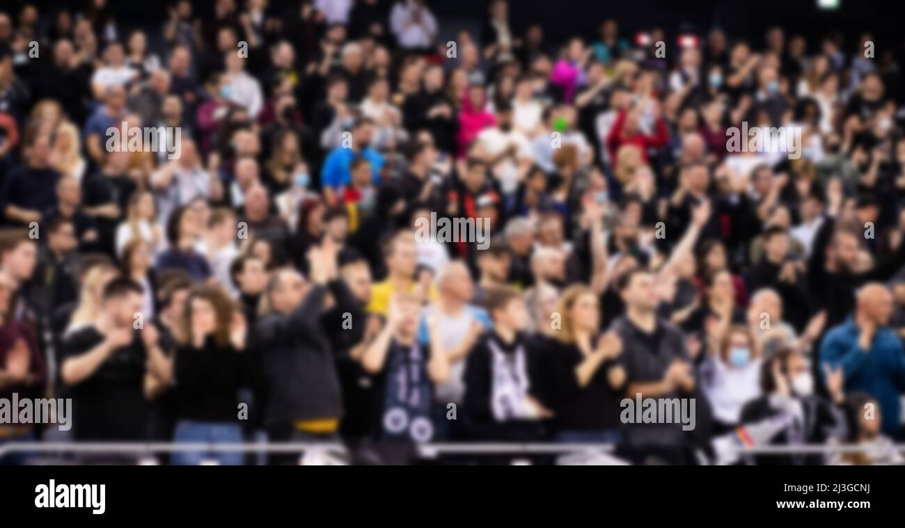 blurred background of supporters at sports event crowd of people in a ...