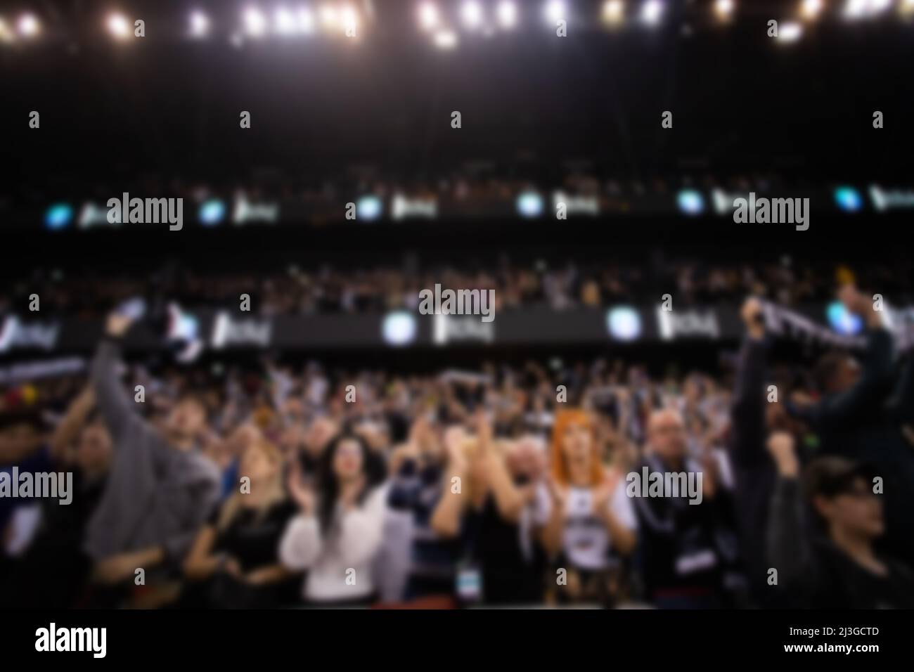 blurred background of supporters at sports event crowd of people in a ...