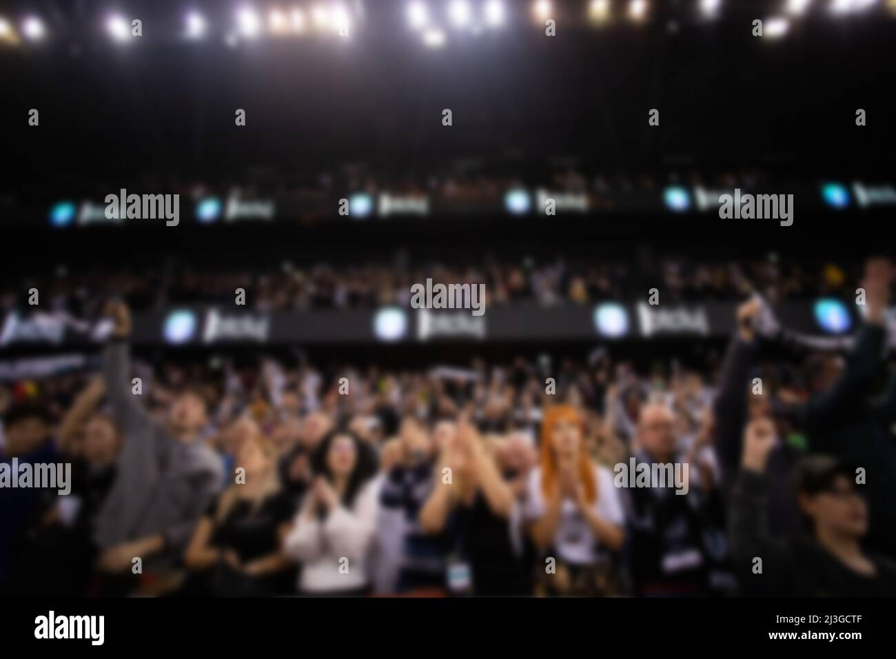 blurred background of supporters at sports event crowd of people in a ...