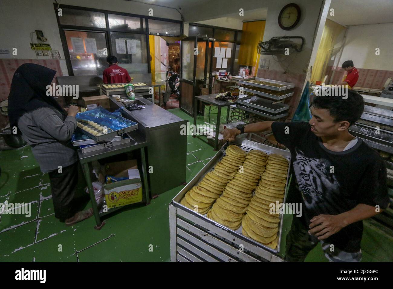 A baker prepares a traditional the Middle East known as Maryam bread or ...