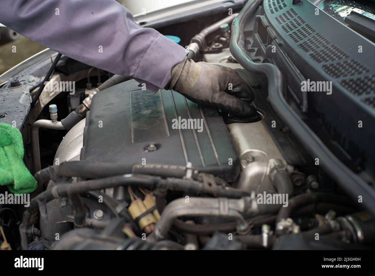Mechanic man hand checking car engine oil maintanance vehicle Stock ...