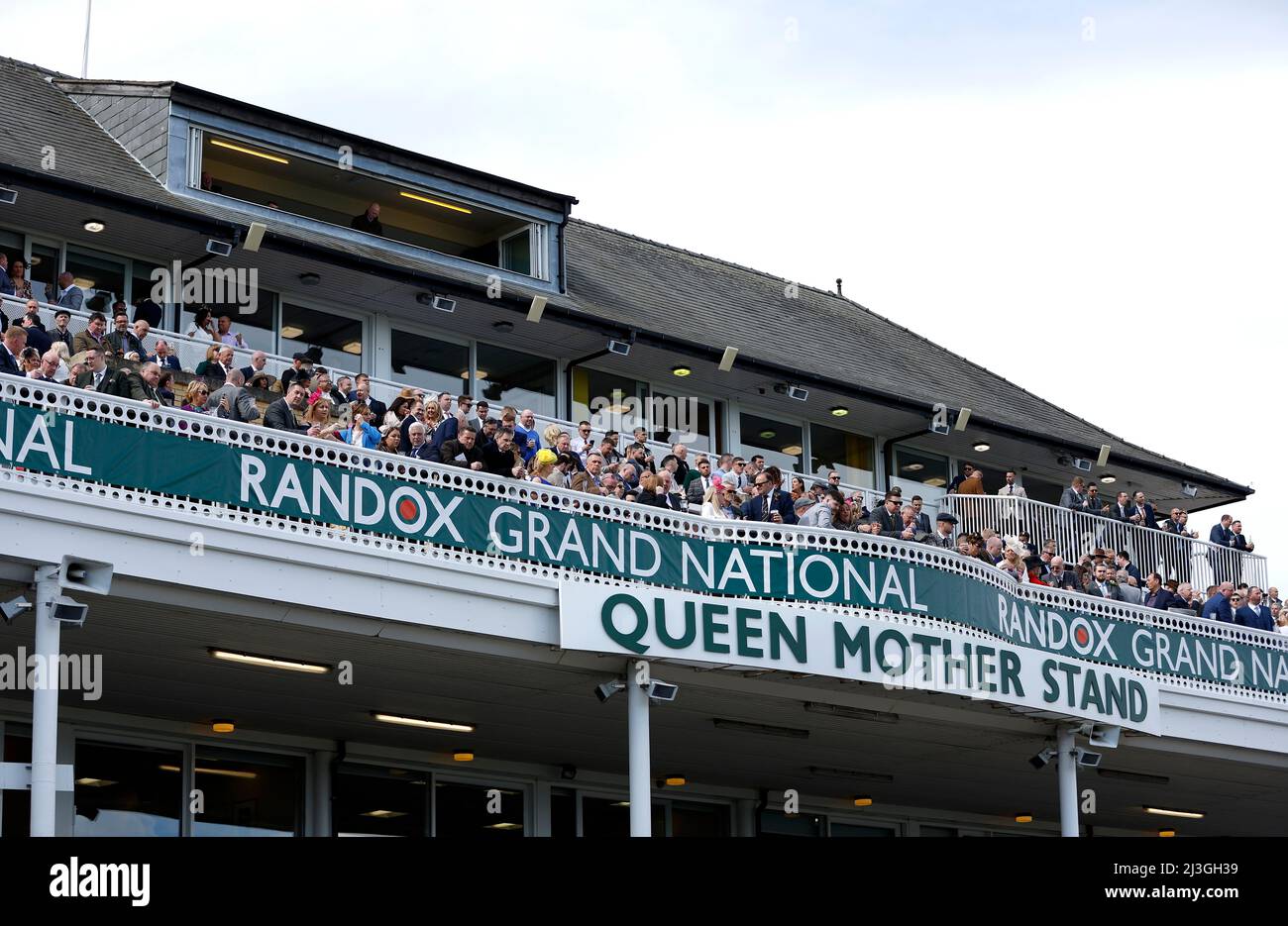 Racegoers in the Queen Mother Stand during Ladies Day at Aintree ...