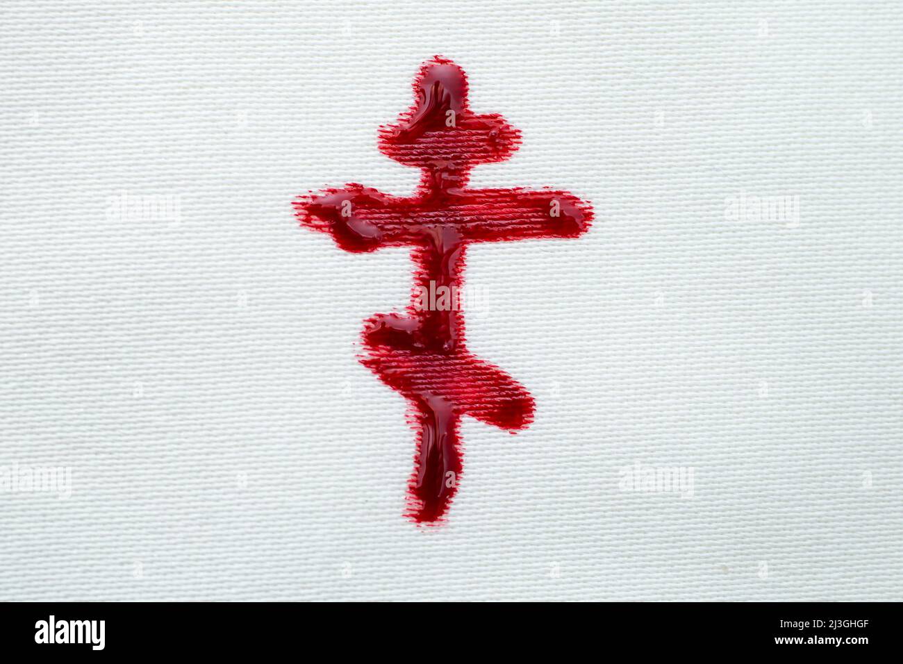 Orthodox crucifix scribbled with blood on white fabric texture Stock ...