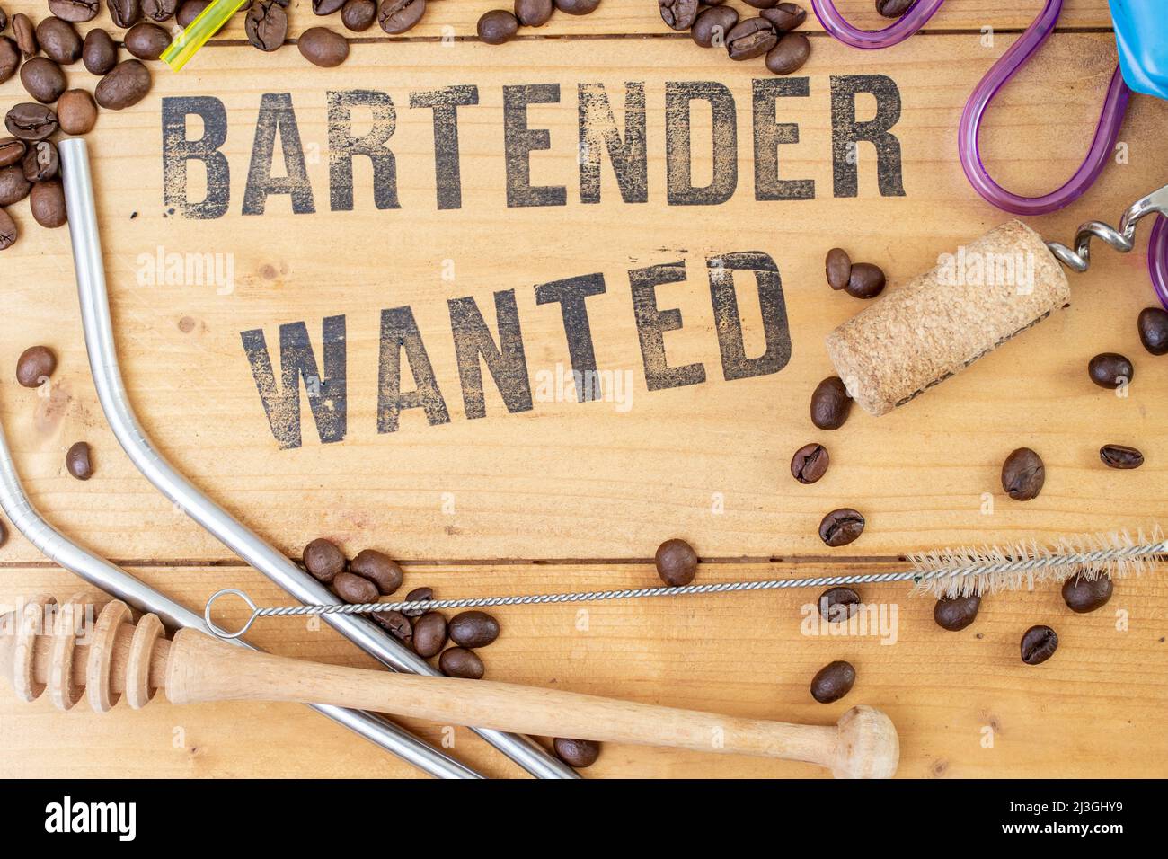 Bartender wanted, written on wooden boards surrounded by coffee beans ...