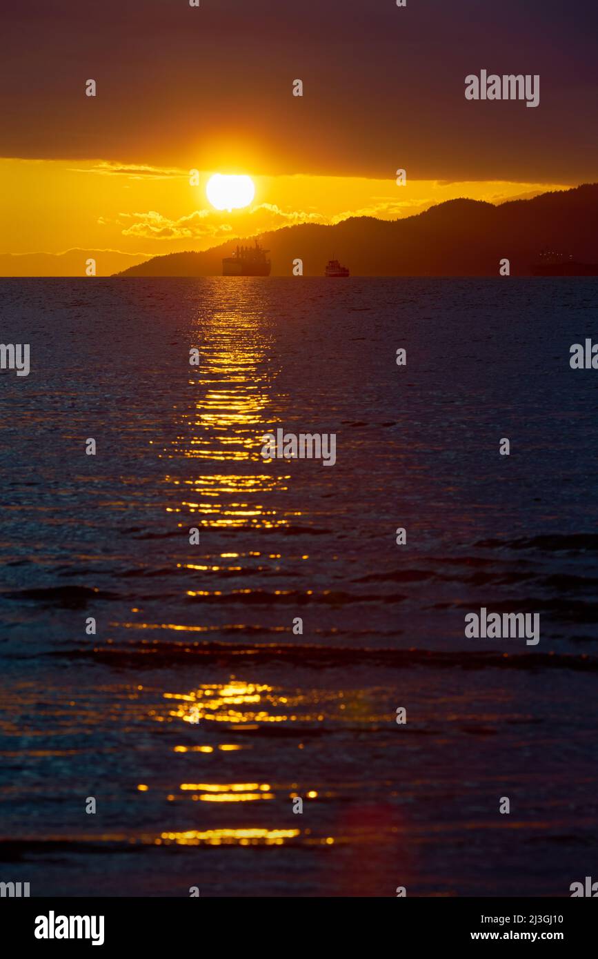 Freighter at Sunset English Bay. Sunset over English Bay and a ...