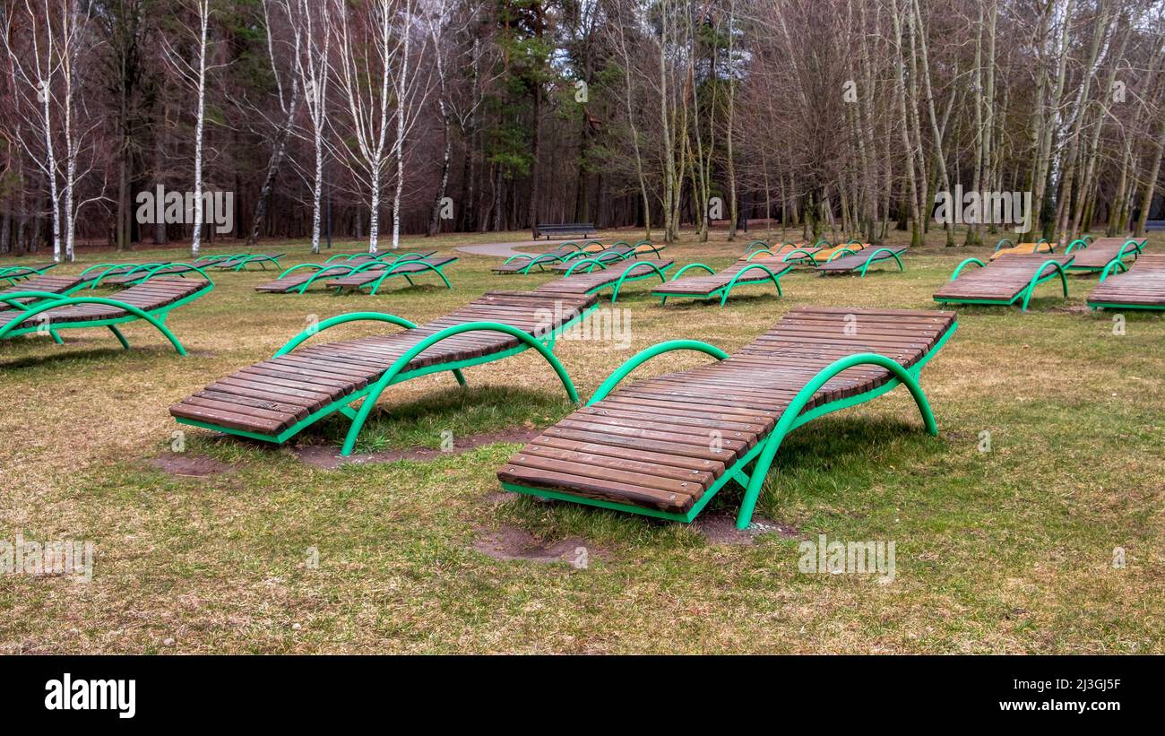 The desert on the beach. Rows of empty sun loungers in early spring ...