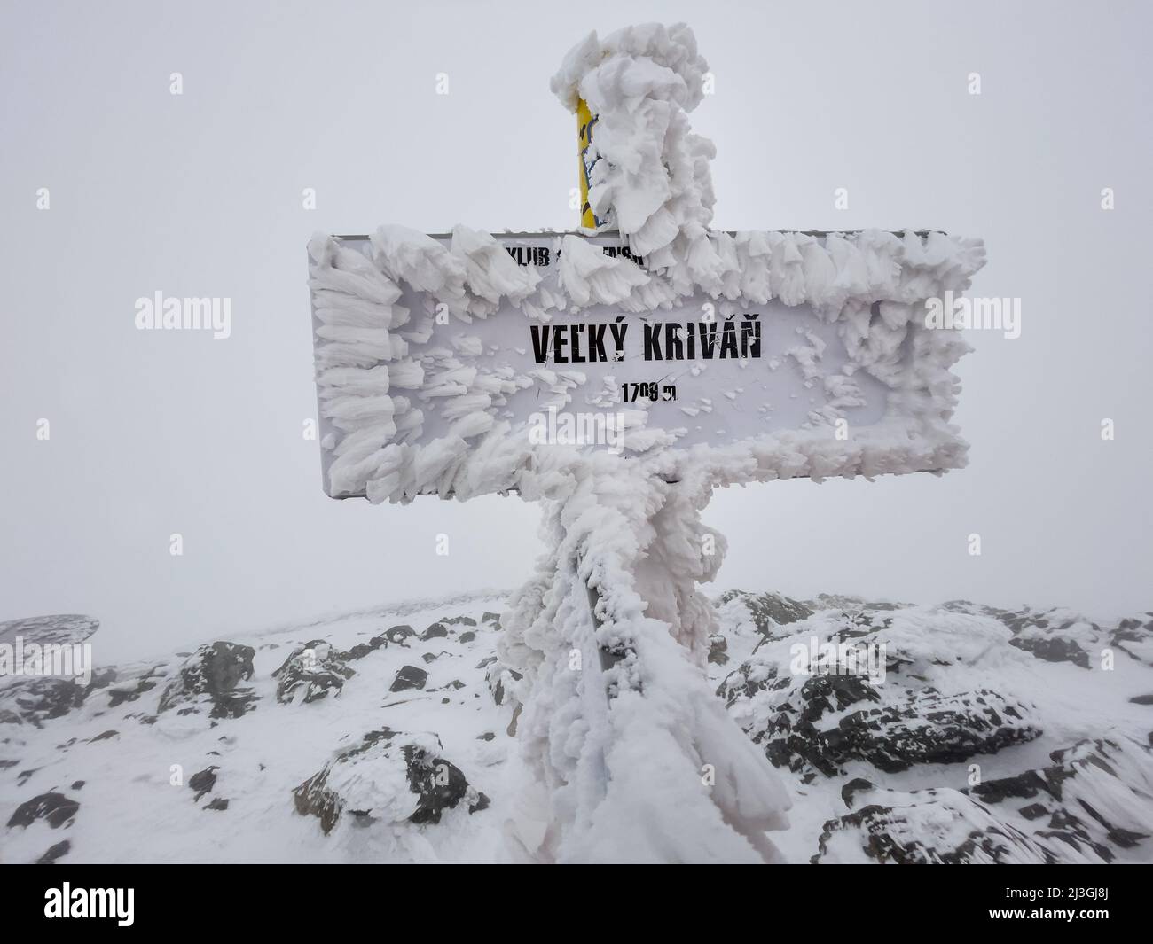 Frozen plate with "Velky Krivan 1709m" inscription on the highest ...