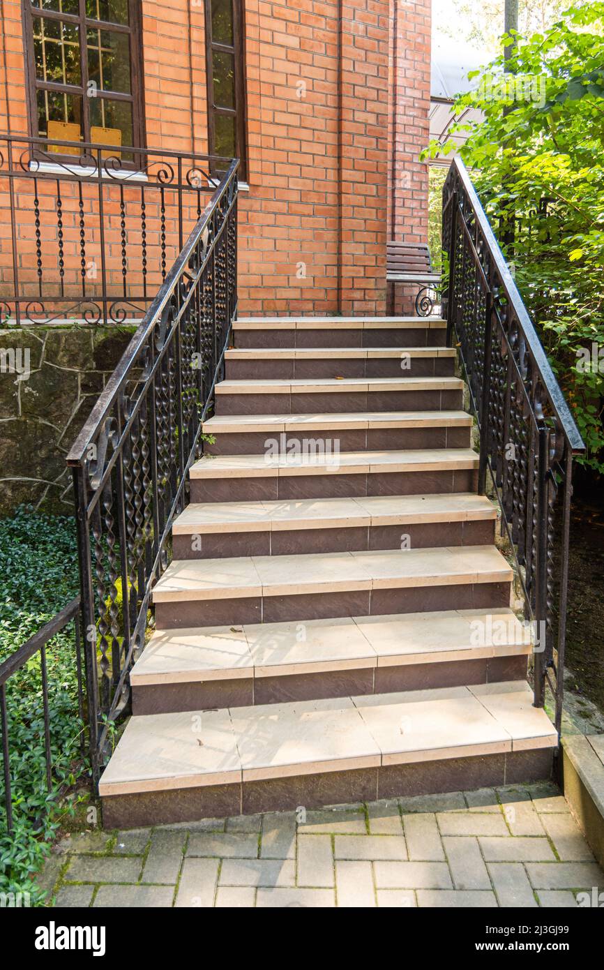 Beautiful staircase with metal railings, close-up Stock Photo - Alamy
