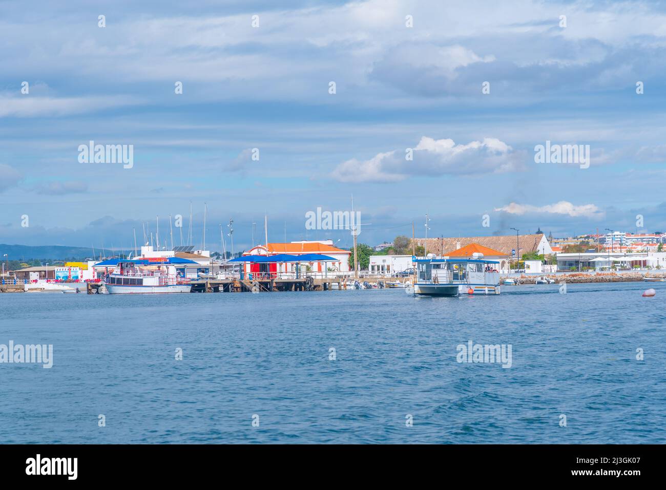 Tourist ferry bringing people to Ilha de Tavira, Portugal Stock Photo ...