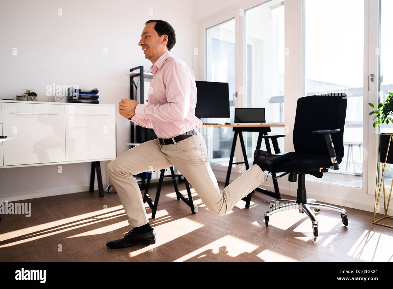 Business Man Doing Bulgarian Split Squat In Office Stock Photo - Alamy