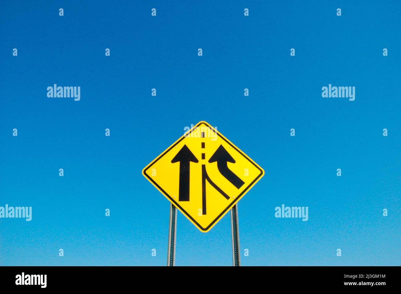 Sign of roadway showing new lane on the right of ongoing traffic Stock ...