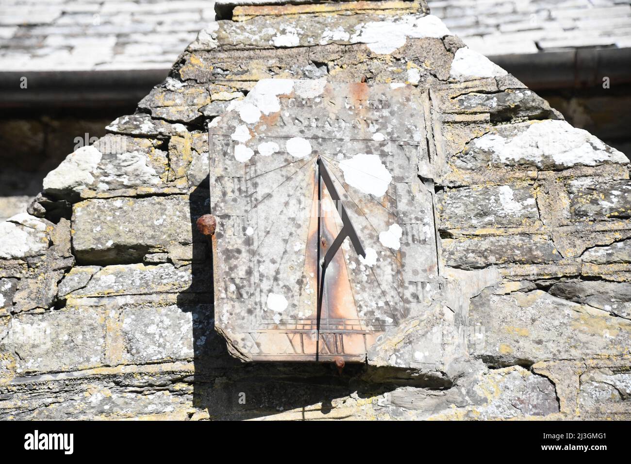 The sundial above the norman doorway into the Church of St Morwenna and ...