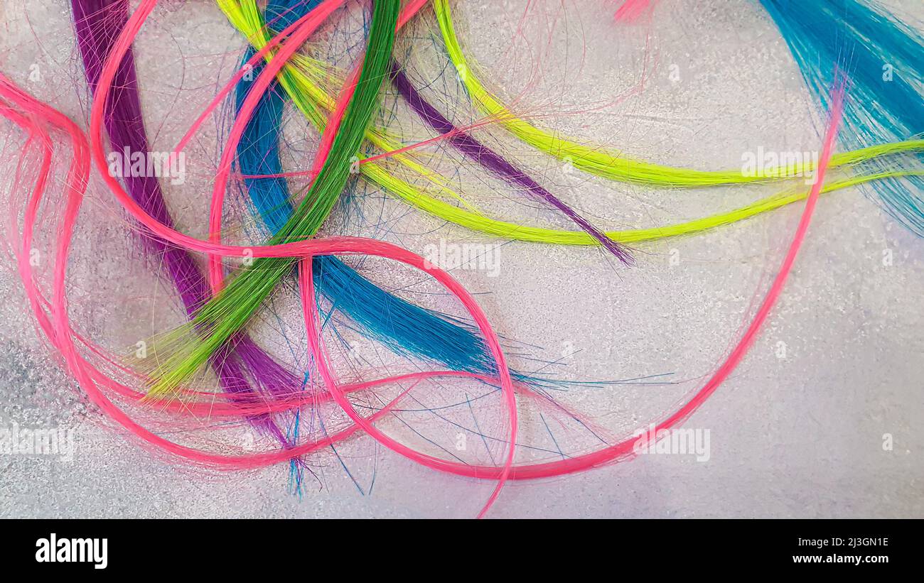 Colored strands for hair extensions. Professional equipment Stock Photo ...