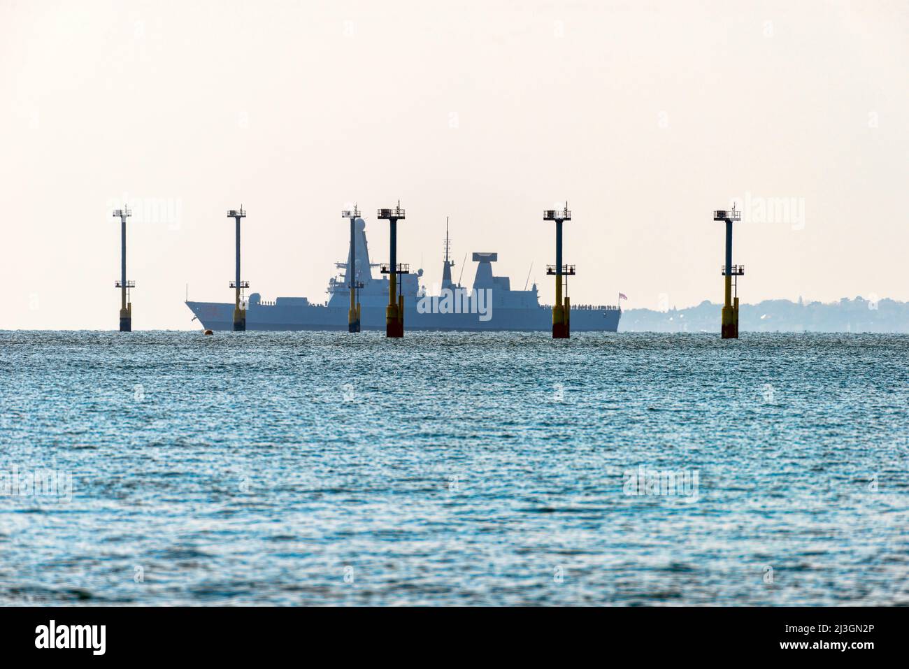 The Royal Navy Type 45 destroyer HMS Dragon passes the aircraft carrier ...