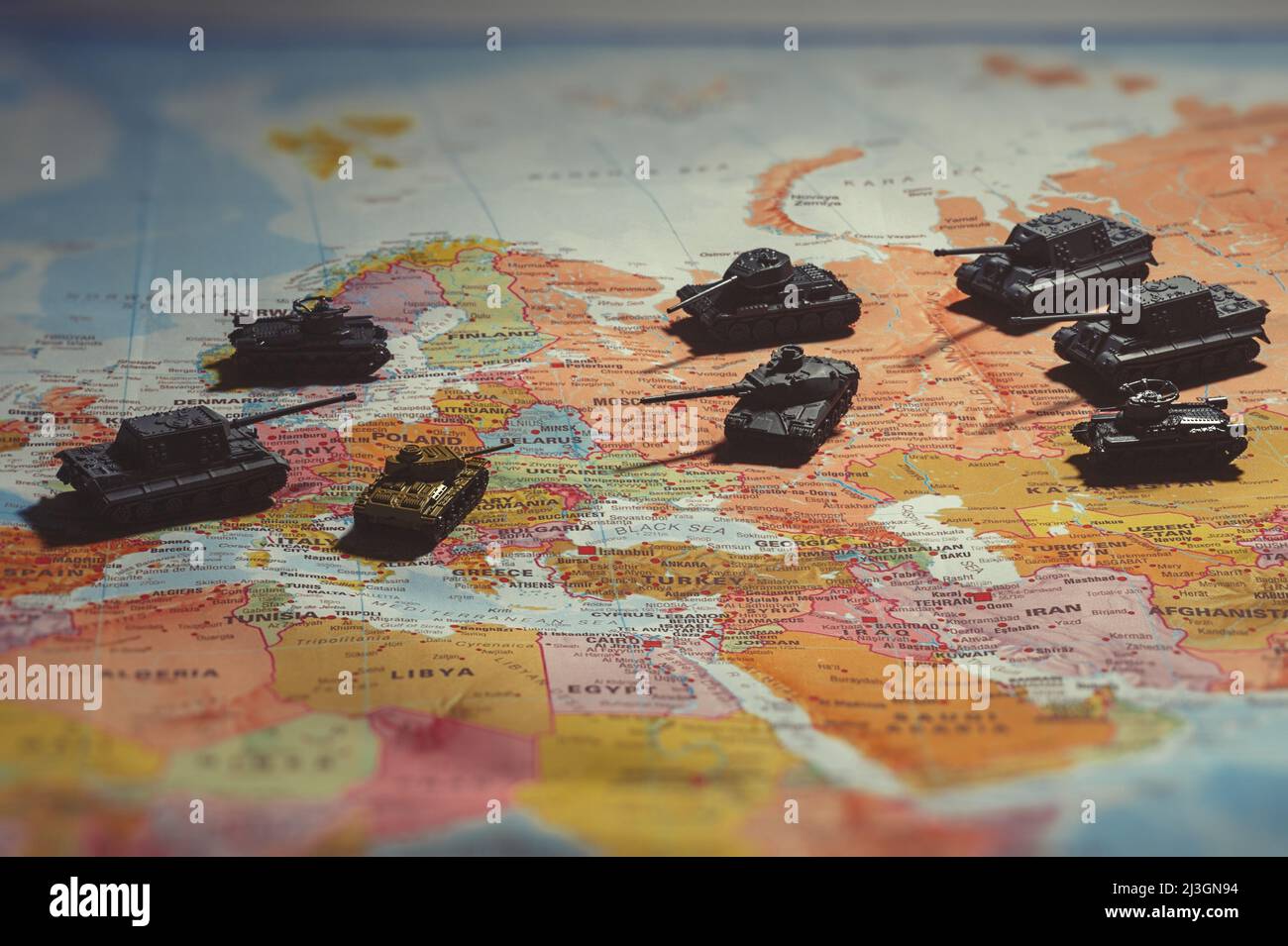 Toy tanks on the map. Concept of confrontation between Europe and ...