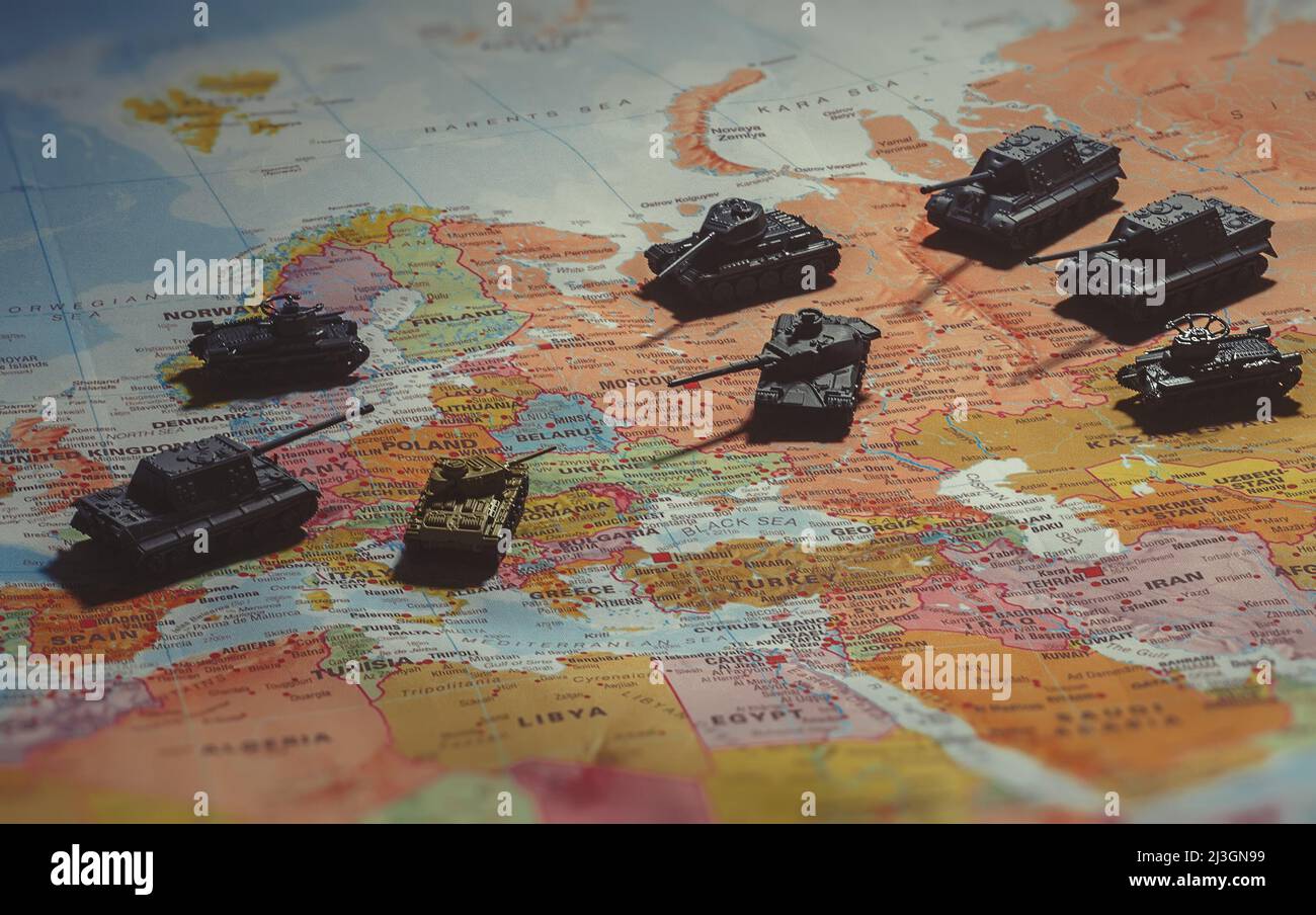 Toy tanks on the map. Concept of confrontation between Europe and ...