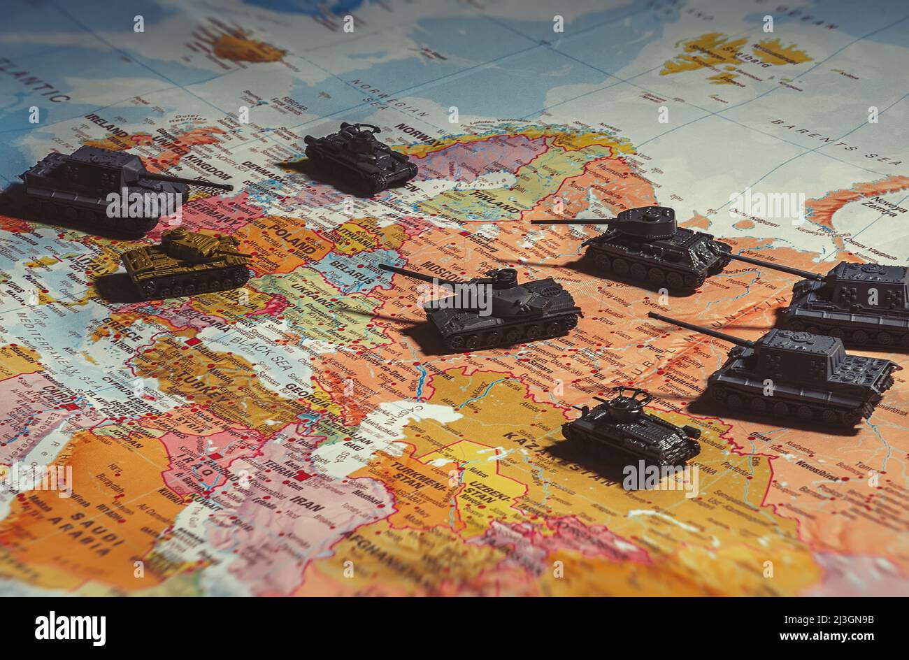 Toy tanks on the map. Concept of confrontation between Europe and ...
