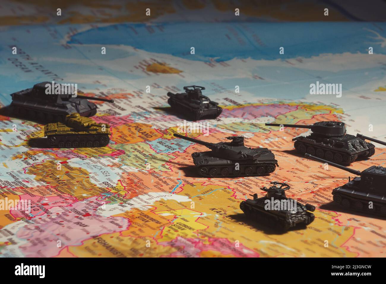 Toy tanks on the map. Concept of confrontation between Europe and ...