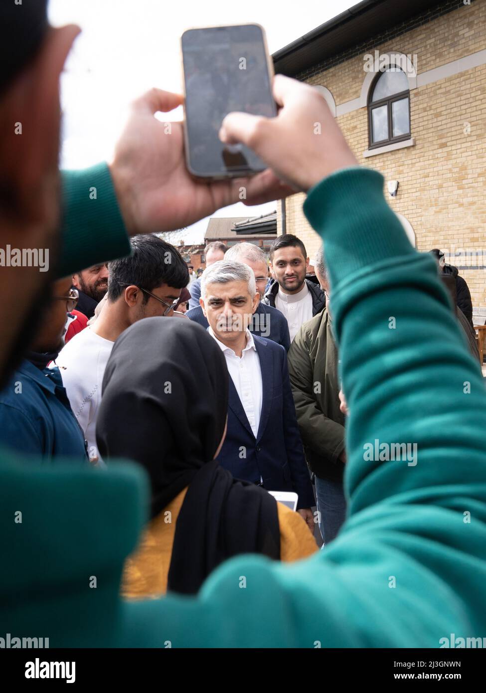 Mayor of London Sadiq Khan (centre) meets worshippers after attending ...