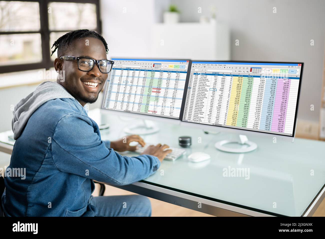 Analyst Employee Working With Spreadsheet On Computer Stock Photo - Alamy