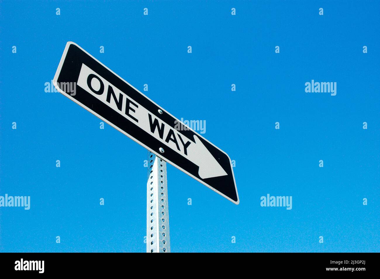 roadway oneway sign showing which way to go on the streets Stock Photo ...