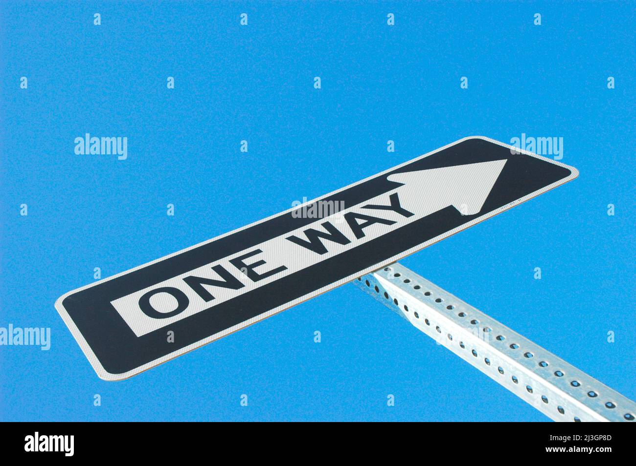 traffic sign pointing for one way travel Stock Photo - Alamy