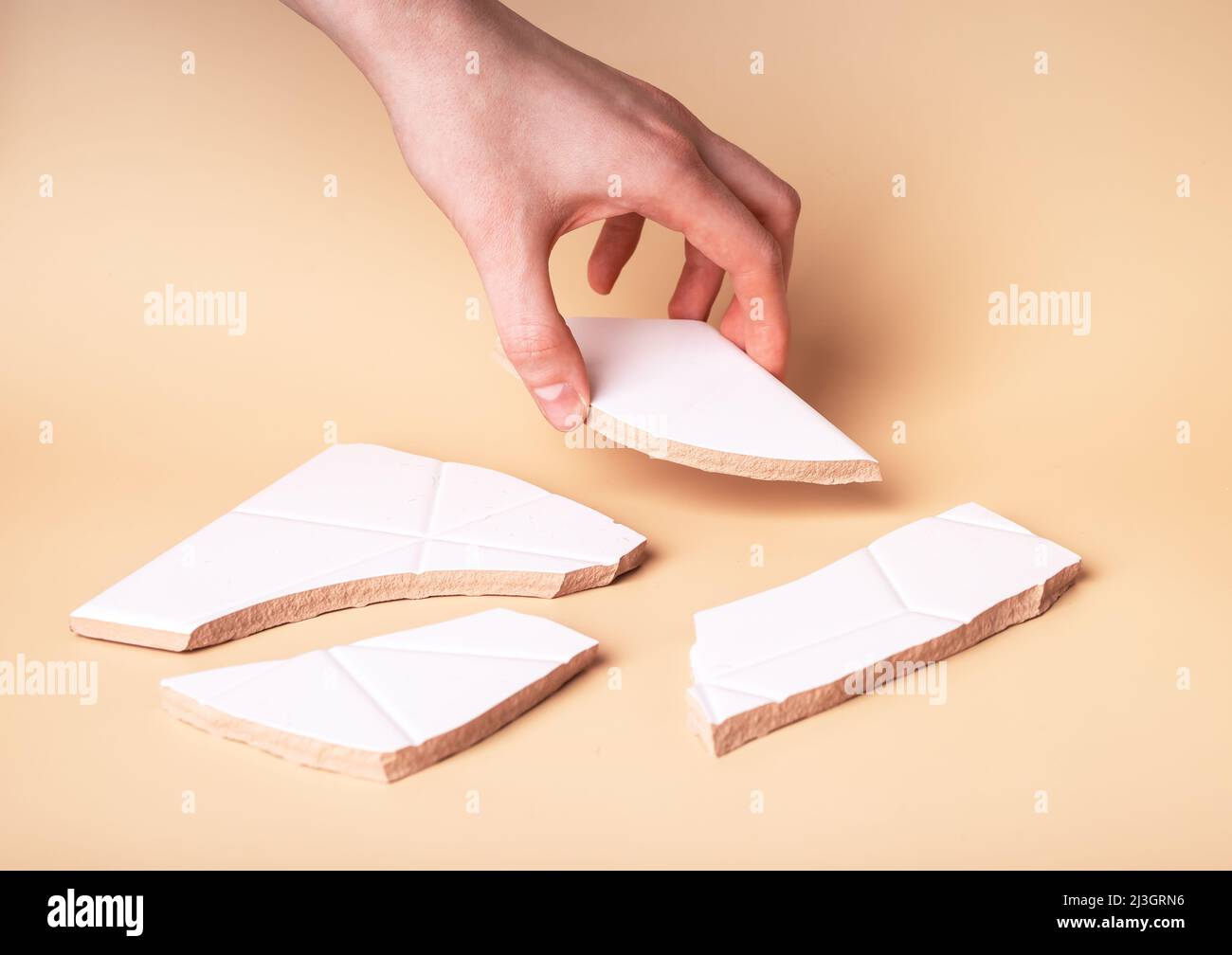 Woman hand cracked tile hi-res stock photography and images - Alamy