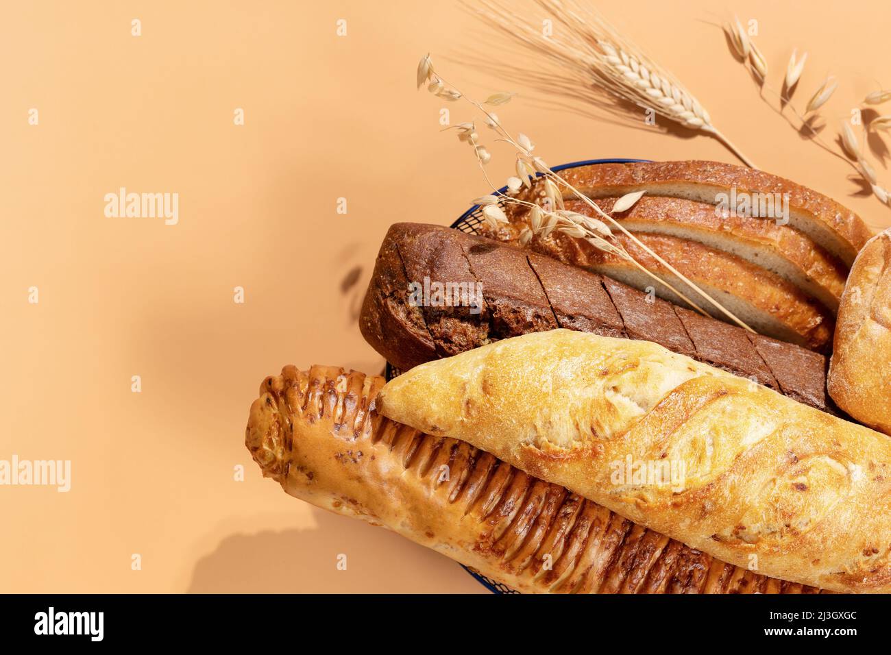 Homemade natural breads. Fresh loafs of bread in the blue basket with ...