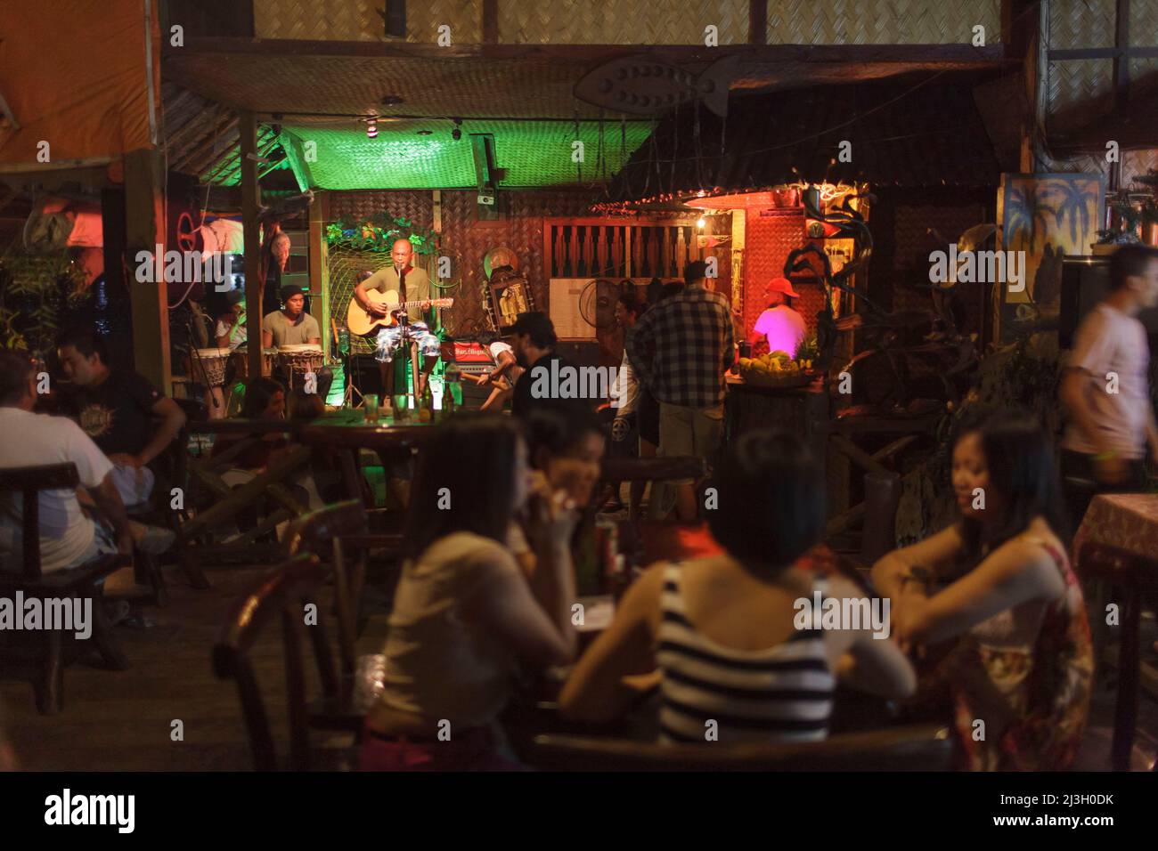 Philippines, Palawan, El Nido, a music band gives a concert in a bar ...