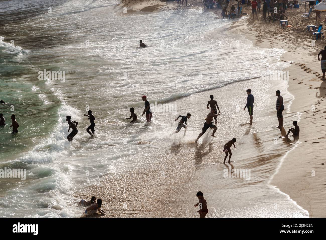 Large group of people on Paciencia beach in the Rio Vermelho ...