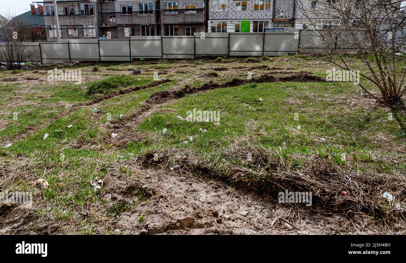 BUCHA, UKRAINE - APRIL 7, 2022 - The tracks left by a military vehicle ...