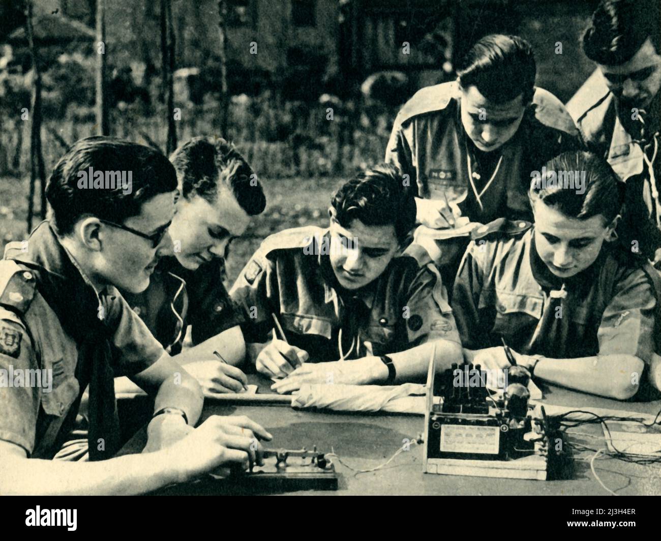'Practice in Morse Signalling', 1944. From "Boy Scouts', by E. E ...