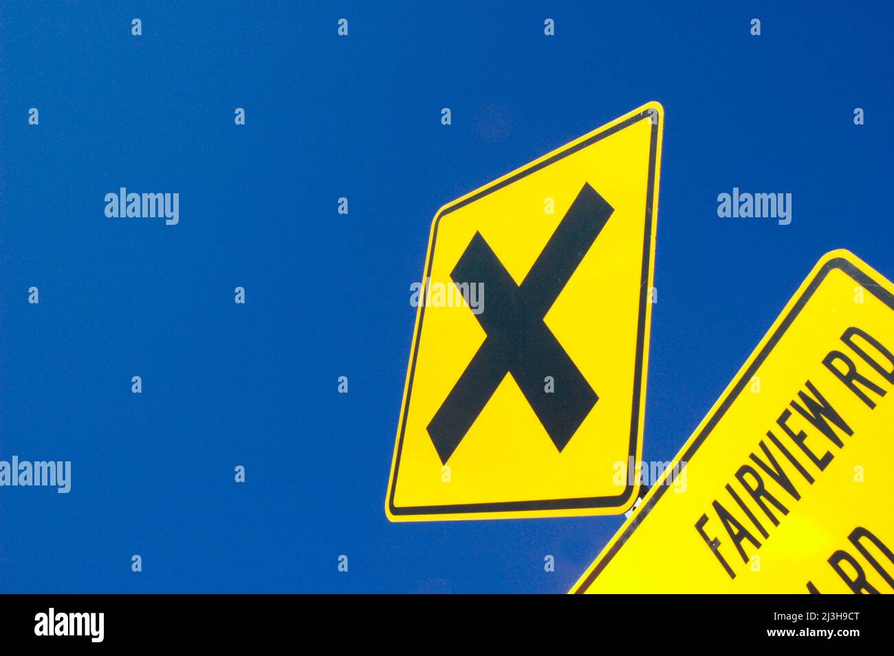 cross roads ahead signs for drivers to see on freeway and roads and ...