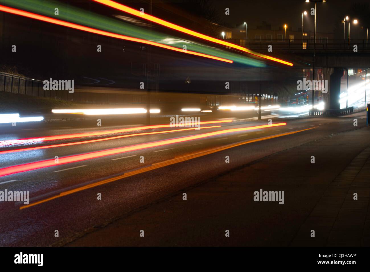 Long exposure photo of traffic driving in evening or night Stock Photo ...